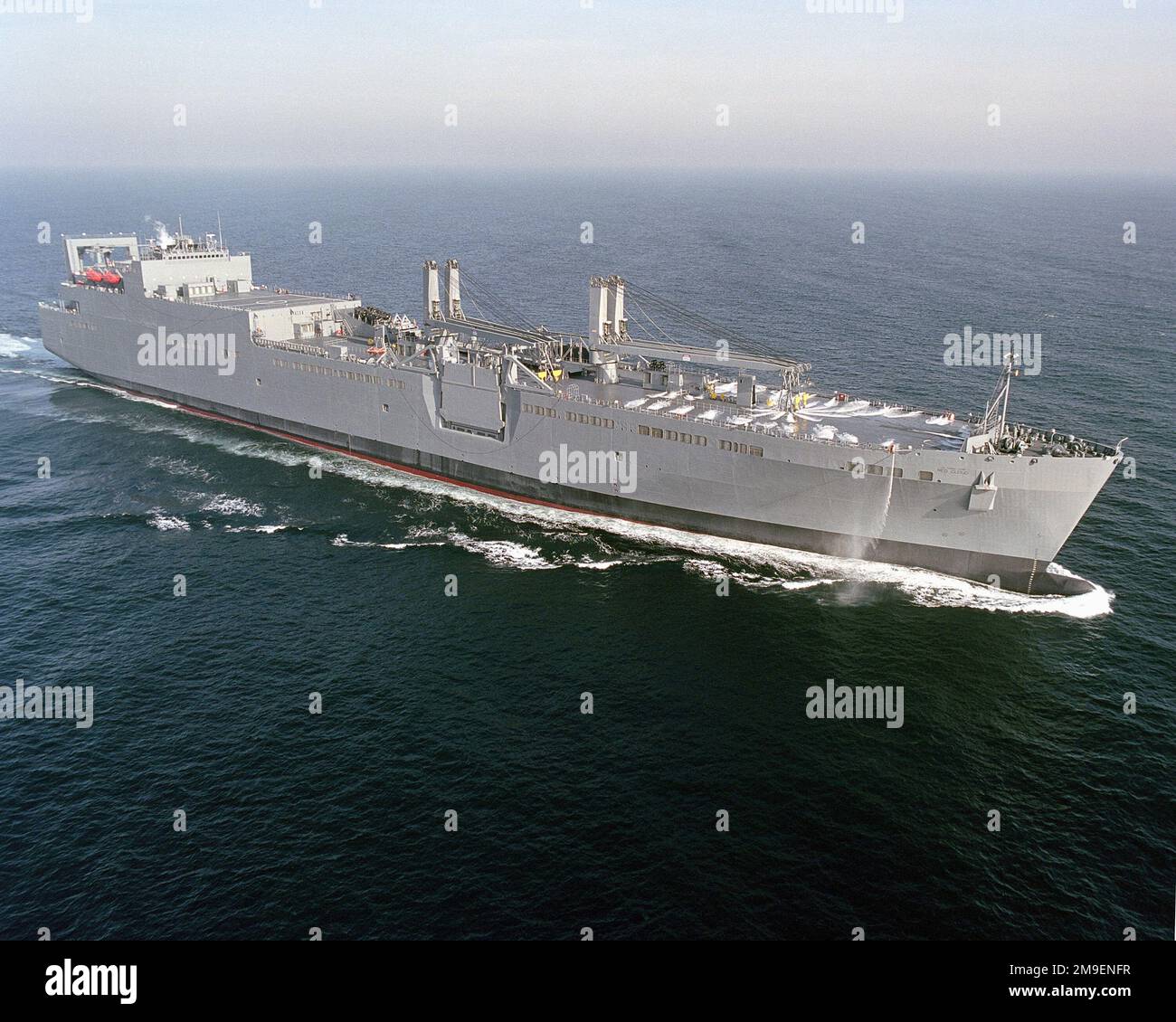 Aerial starboard bow view of the MSC (Military Sealift Command) strategic heavy lift ship USNS ...
