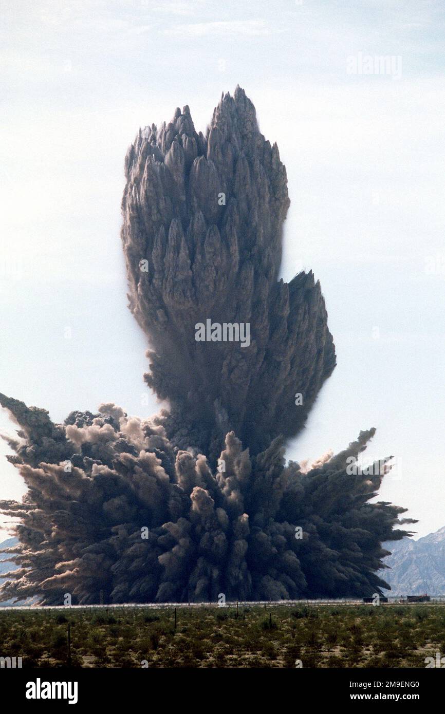 Smoke, dust and debris rise into the air as 3.5 million pounds of high ...