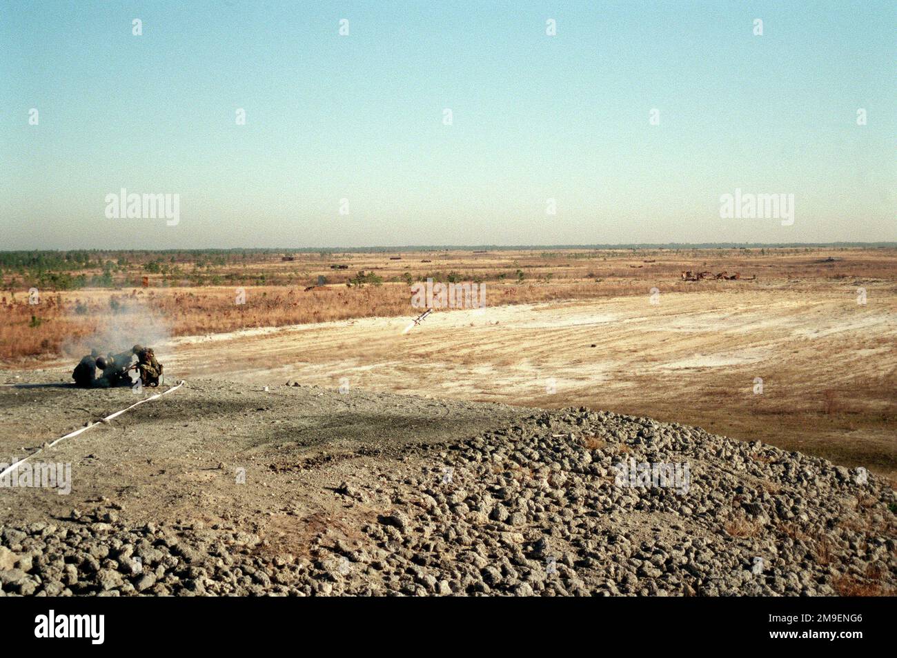 Rear view long shot of three US Marines put on a demonstration of a ...