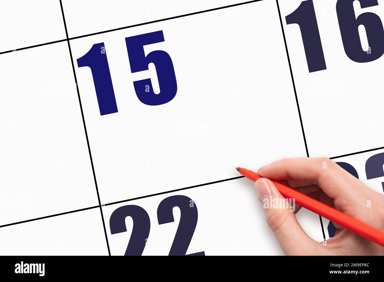 15th day of the month. Hand holding the red pen points to an empty ...
