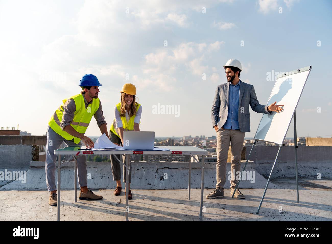 Business, teamwork and people concept. Group of engineers and ...