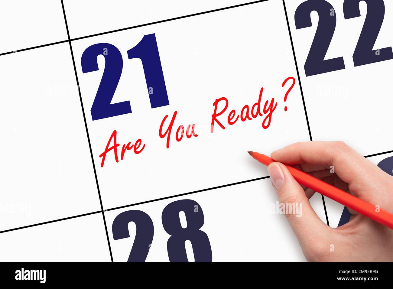 21st day of the month. Hand writing text ARE YOU READY on calendar date ...