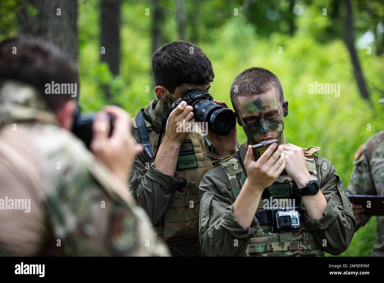 Israel Defense Force (IDF) Sgt. Roi Albik, center left, a visual ...