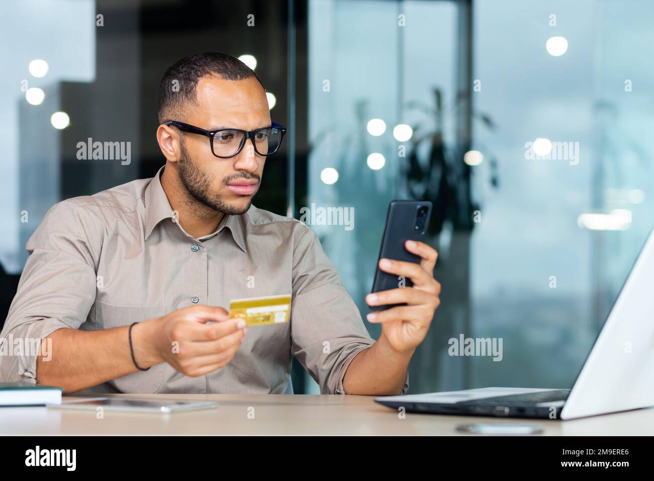 Dissatisfied and angry businessman in office trying to make purchase in ...
