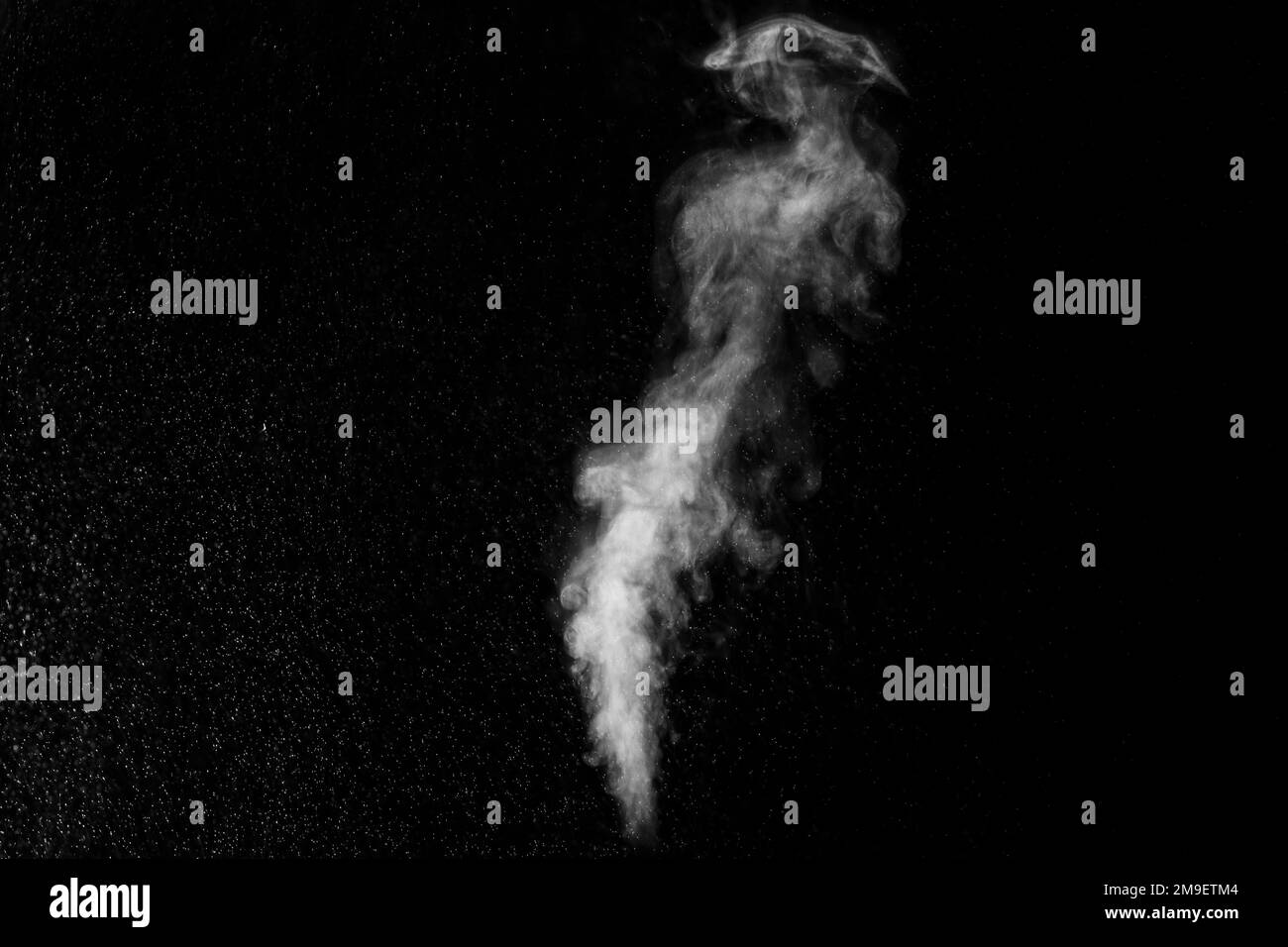 A jet of white water vapor with splashes of water from the humidifier ...