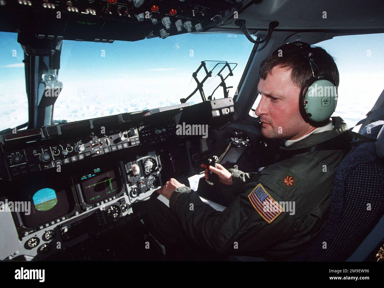 US Air Force Major Dean Pfab, co-pilot, at the controls of a C-17 ...