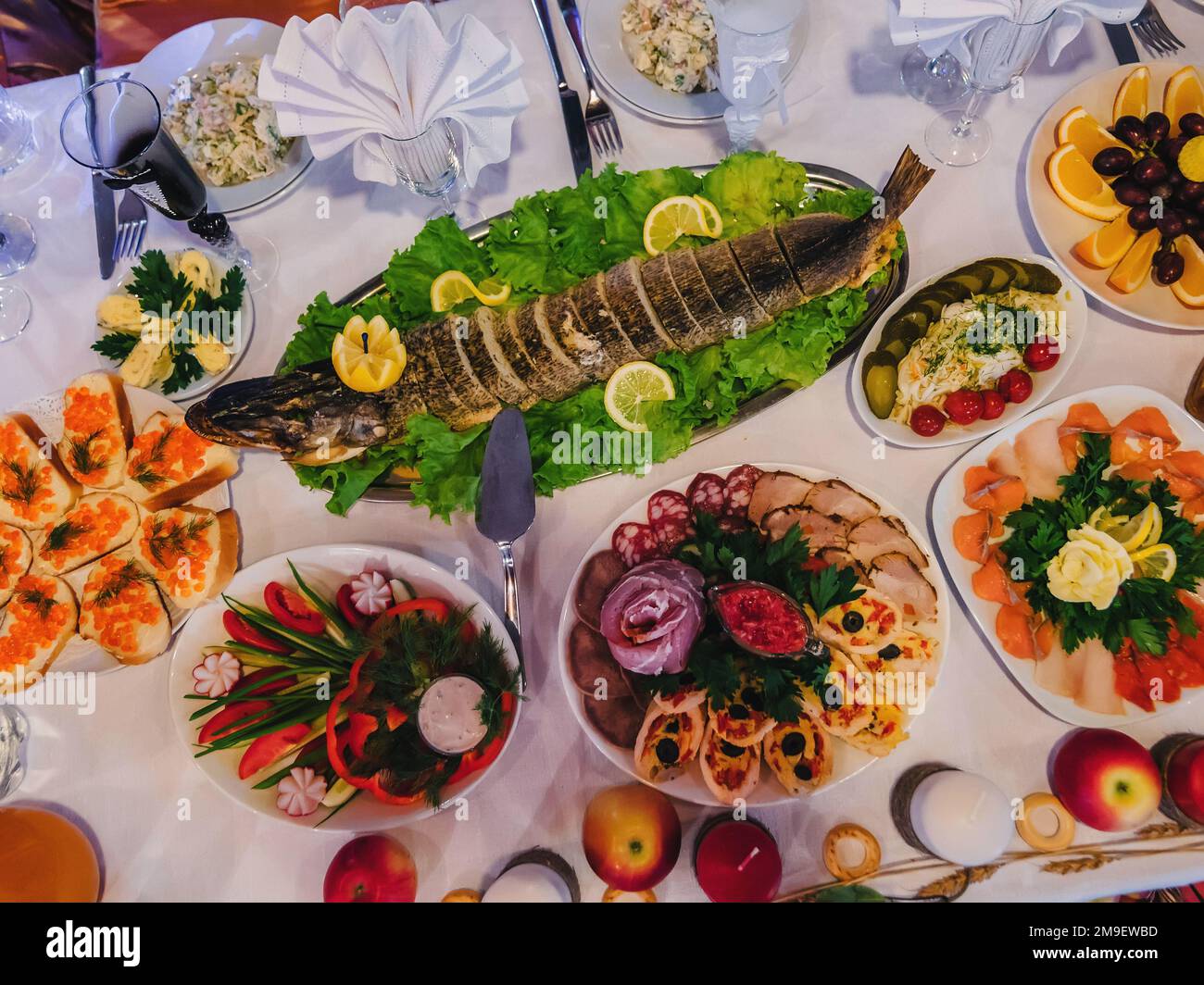 traditional Russian cuisine with baked stuffed pike and other snacks on ...