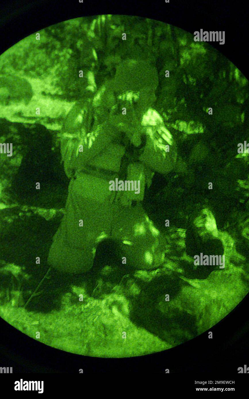 Straight on medium close-up shot at nighttime through a Starlight ...