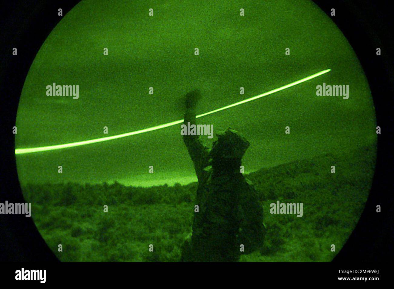 Left side profile medium shot at nighttime through a Starlight System ...