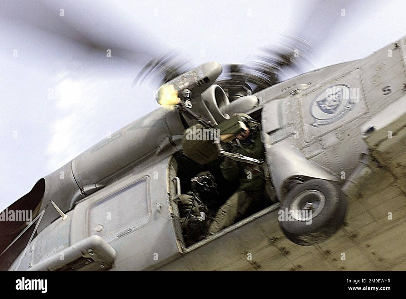 Left side profile, medium close-up shot from a low angle, looking up at ...