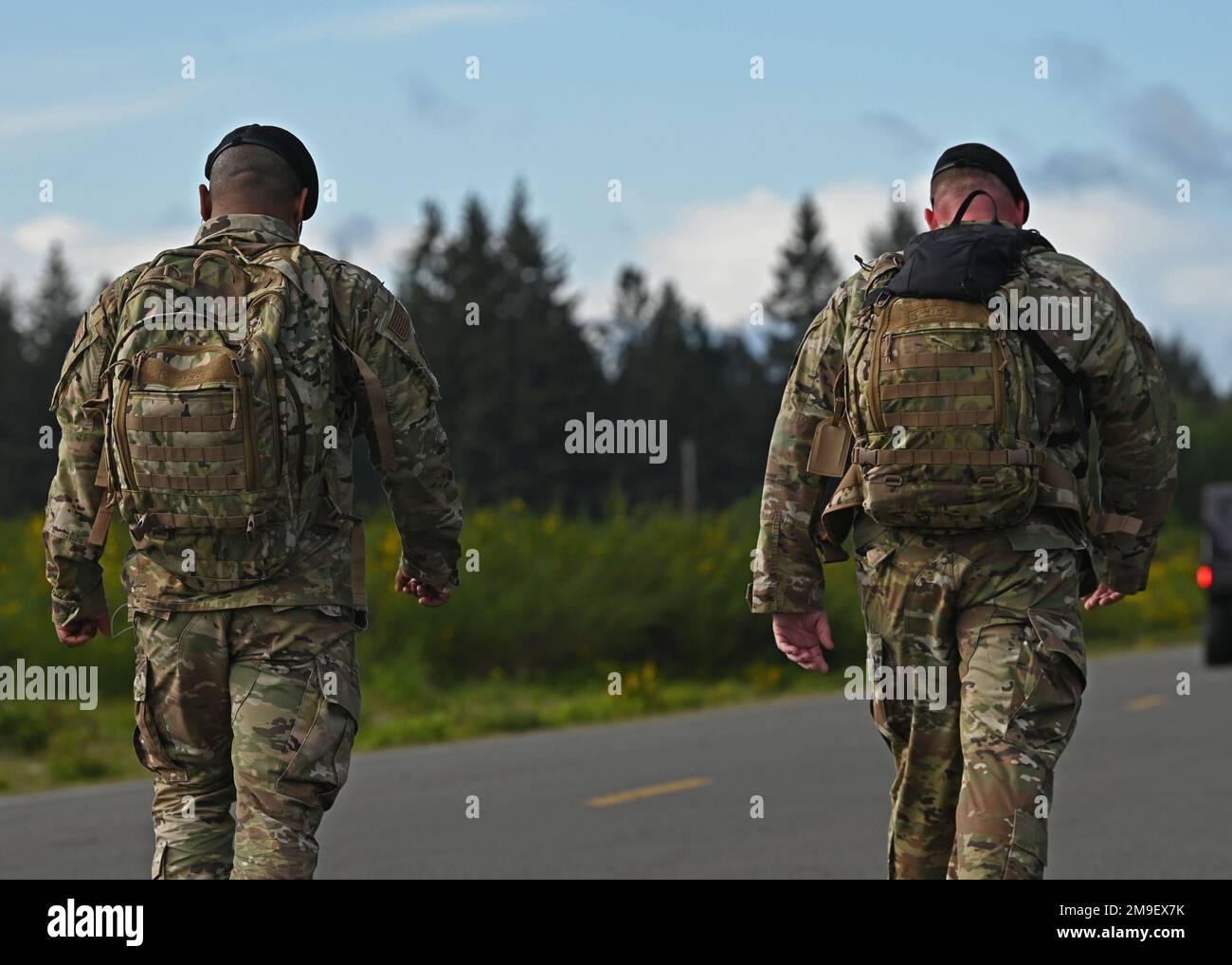 U.S. Airmen with the 627th Security Forces Squadron participate in a five-mile ruck in honor of ...