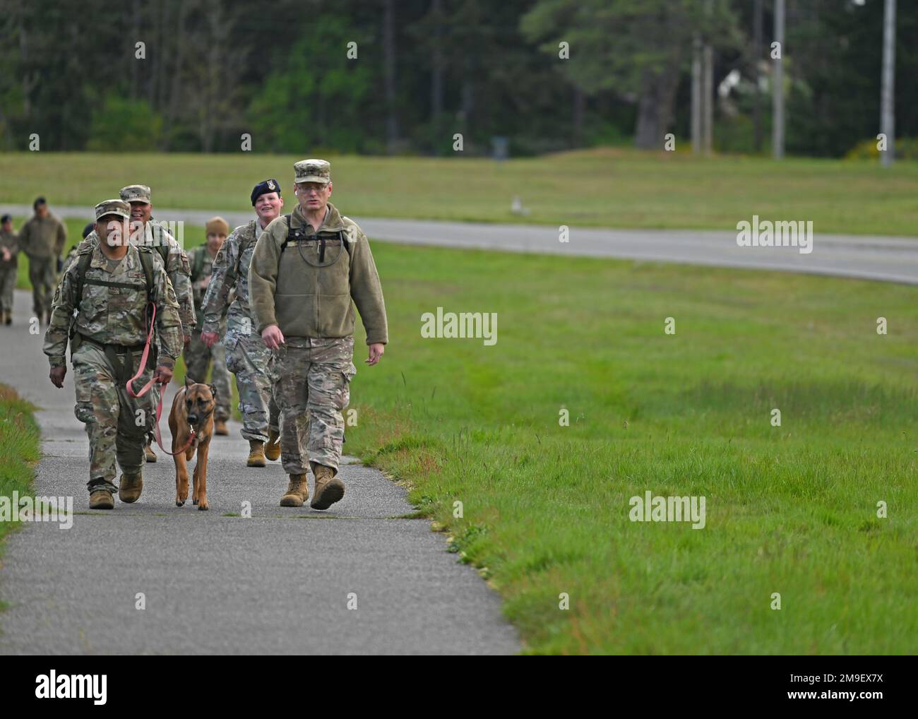 U.S. Airmen with the 627th Security Forces Squadron participate in a five-mile ruck in honor of ...