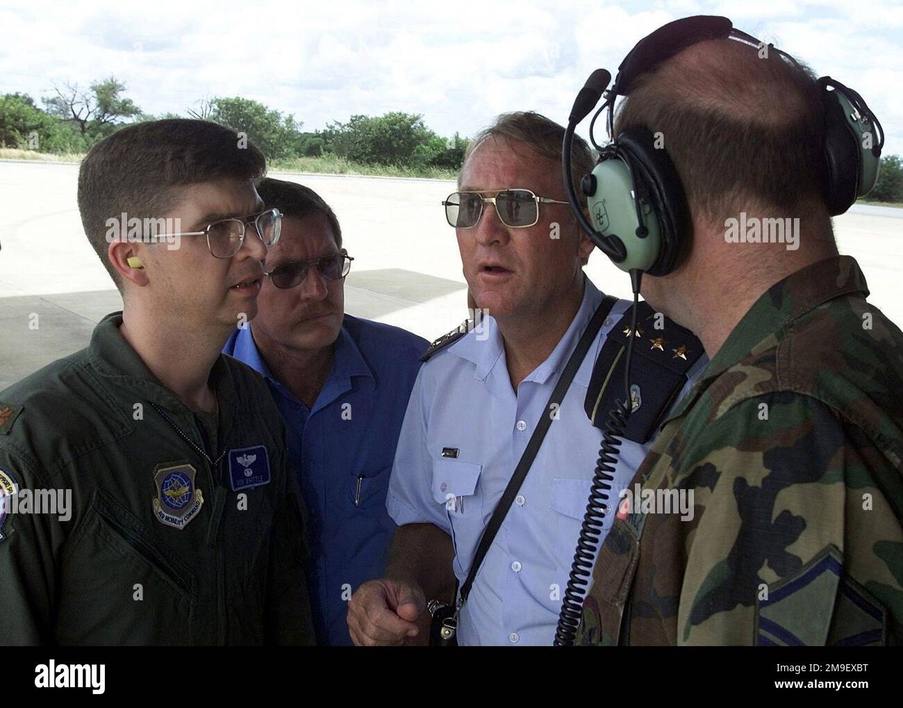 Straight on medium close-up from left to right as Major Ronald Whittle ...