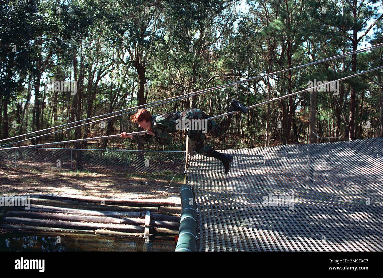A US Marine Corps recruit from 4th Battalion Negotiates her way down ...