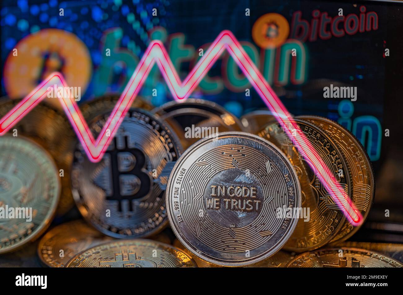 Bitcoin logo displayed on mobile with representation of Bitcoins ...