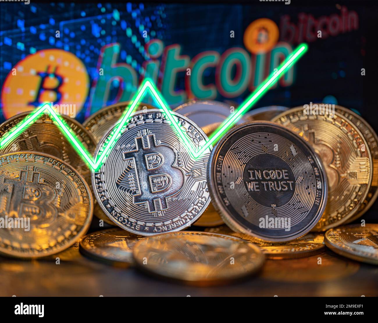 Bitcoin logo displayed on mobile with representation of Bitcoins ...