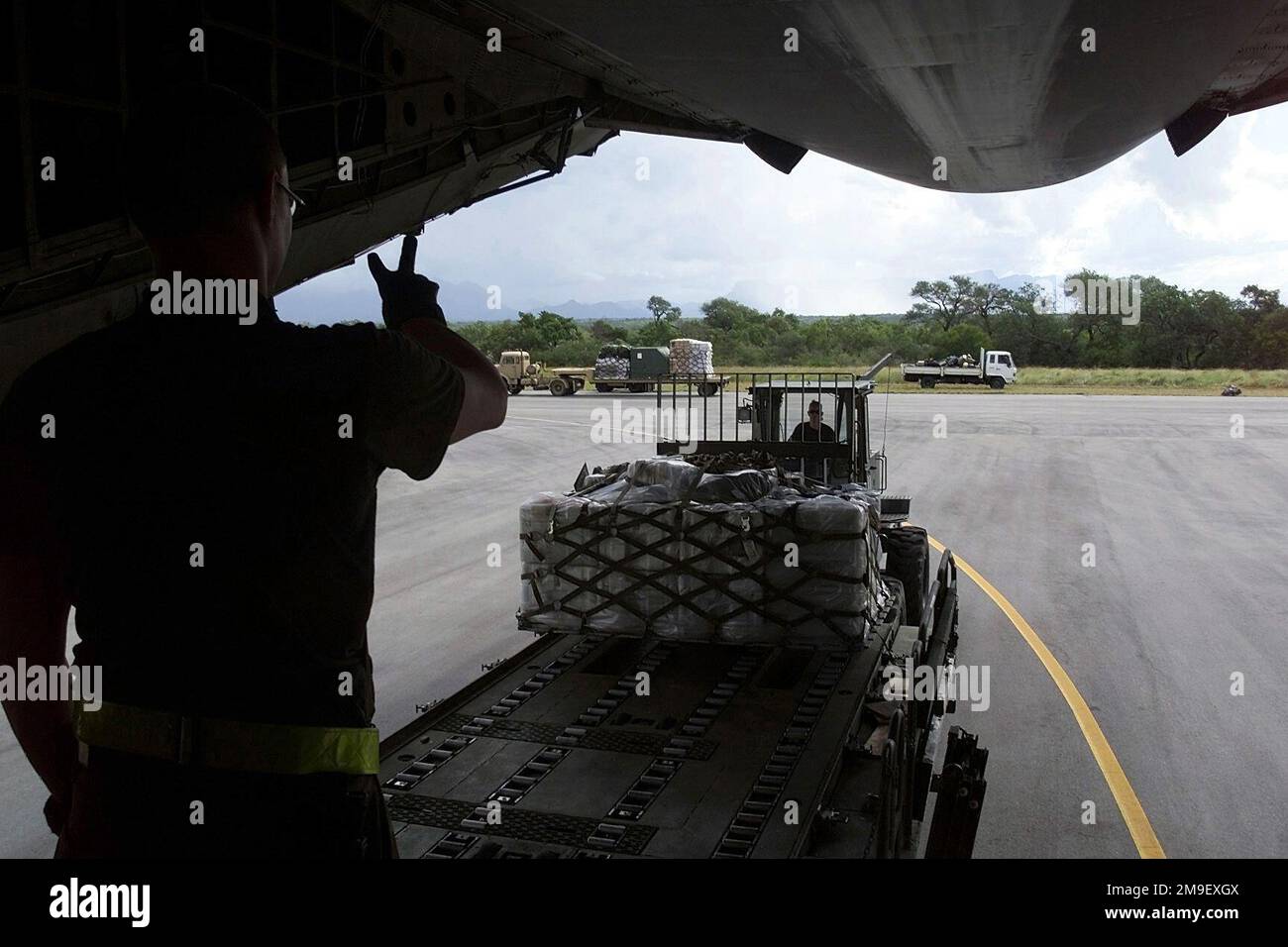A rear view over the right shoulder of an unidentified USAF AIRMAN as ...
