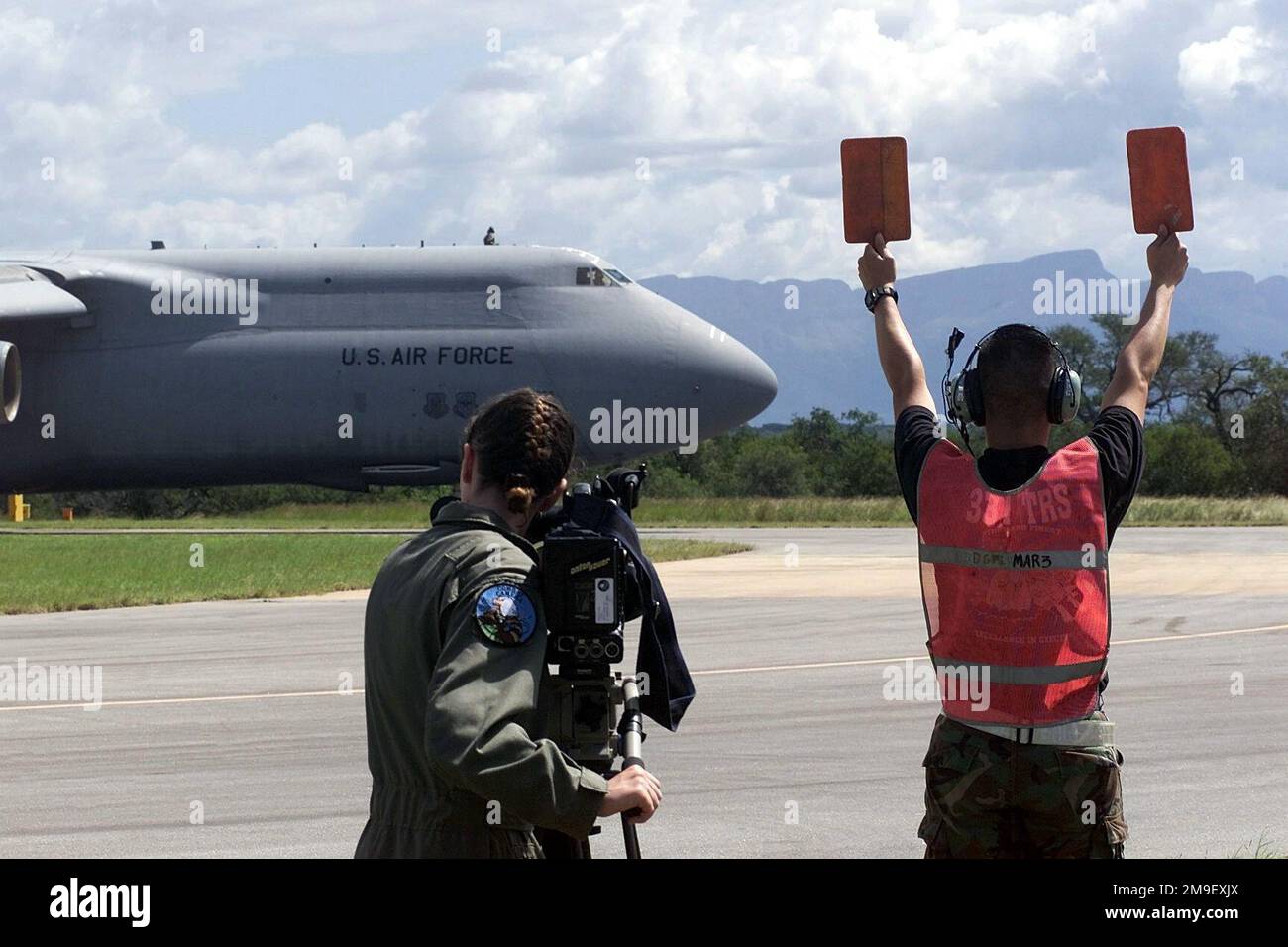 Straight on rear view medium shot as SENIOR AIRMAN Carrie Cole, a ...