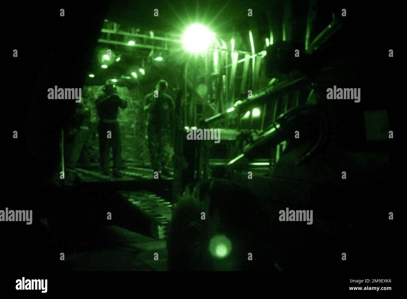 Left side rear view medium shot at nighttime through a Starlight System ...