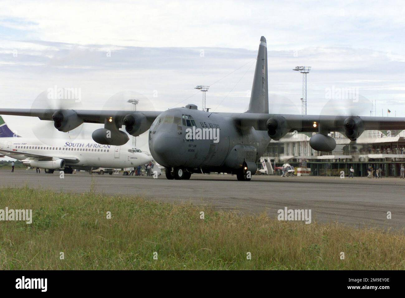 Left side front view medium long shot as a US Air Force C-130 from the ...