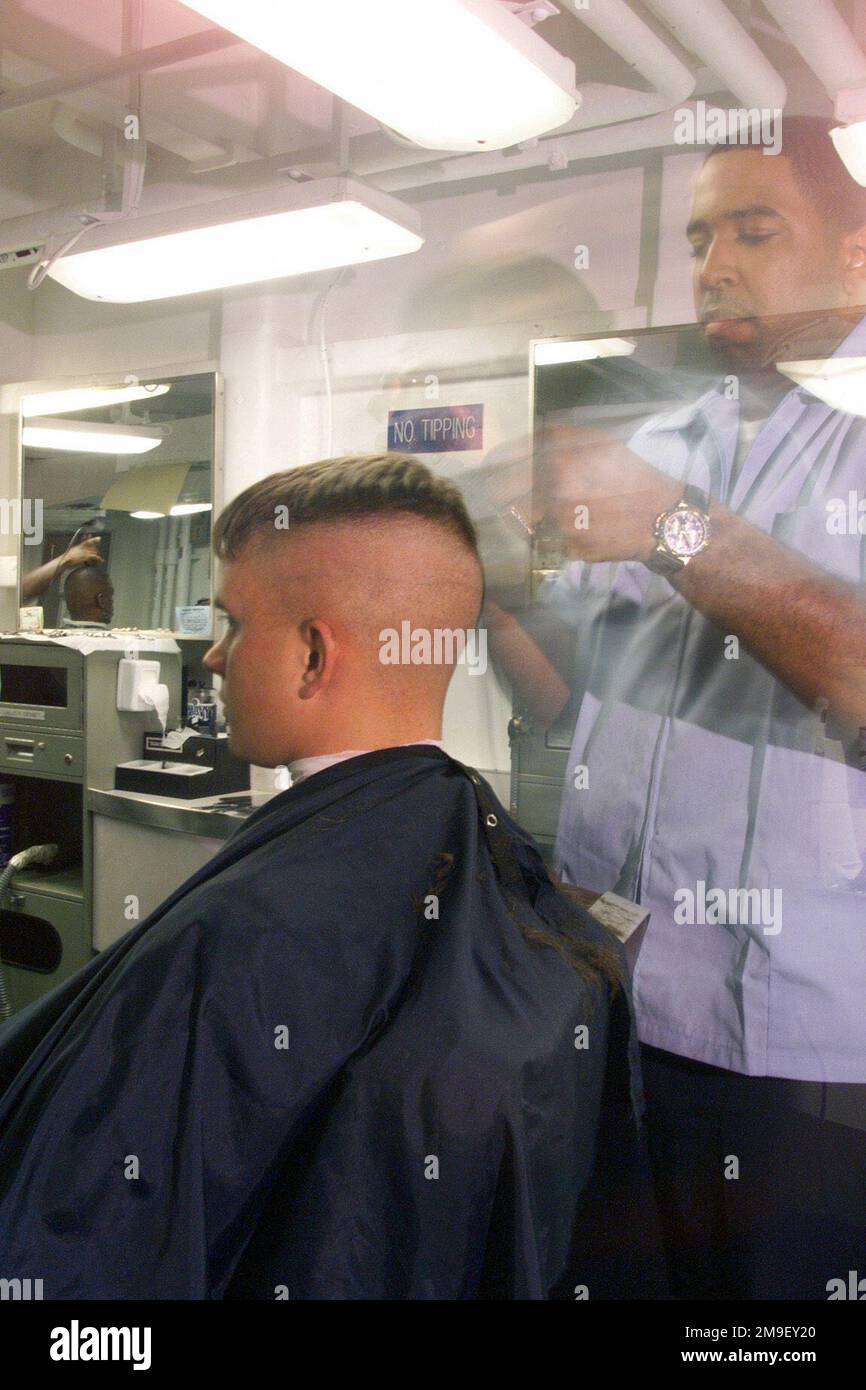 Ship's Serviceman Third Class John Robinson of USS Harry S. Truman (CVN ...