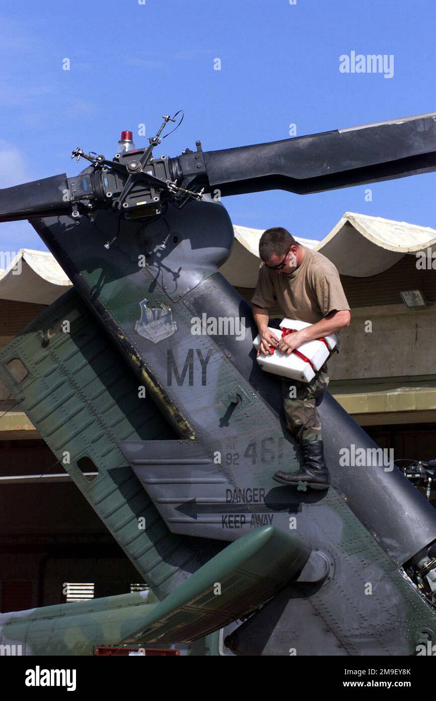 Medium long shot. AIRMAN First Class Brewster Esses, a MH-60 Pave Hawk ...