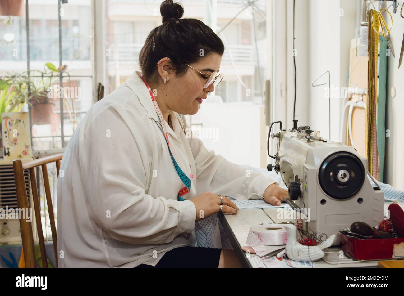 profile view of young caucasian woman, freelancer of Argentinian ...