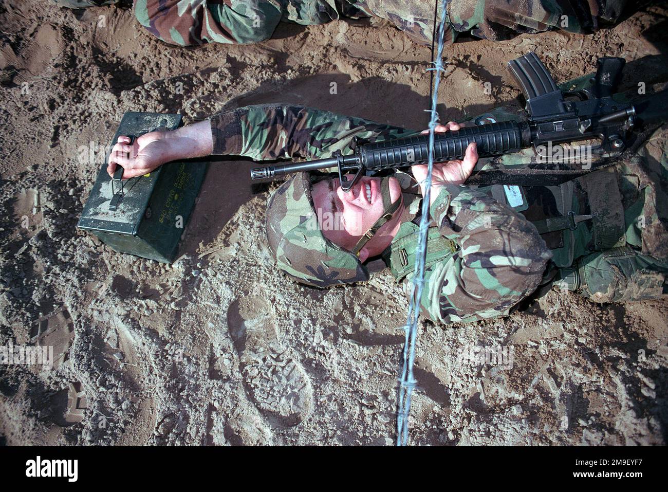 US Marine Corps Recruit Thomas back crawls under barb wire while ...