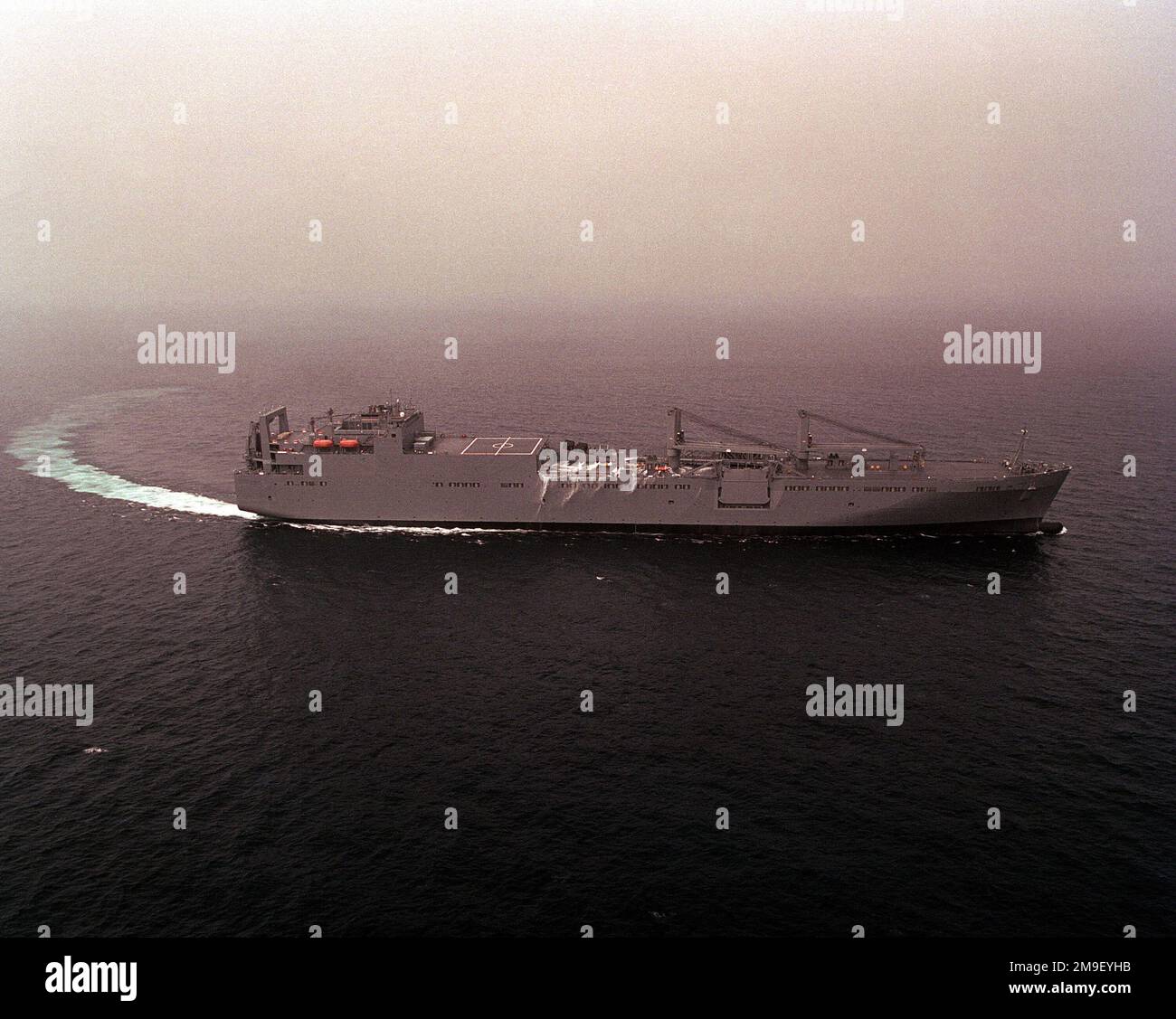 Aerial starboard side view of the MSC (Military Sealift Command) strategic heavy lift ship USNS ...