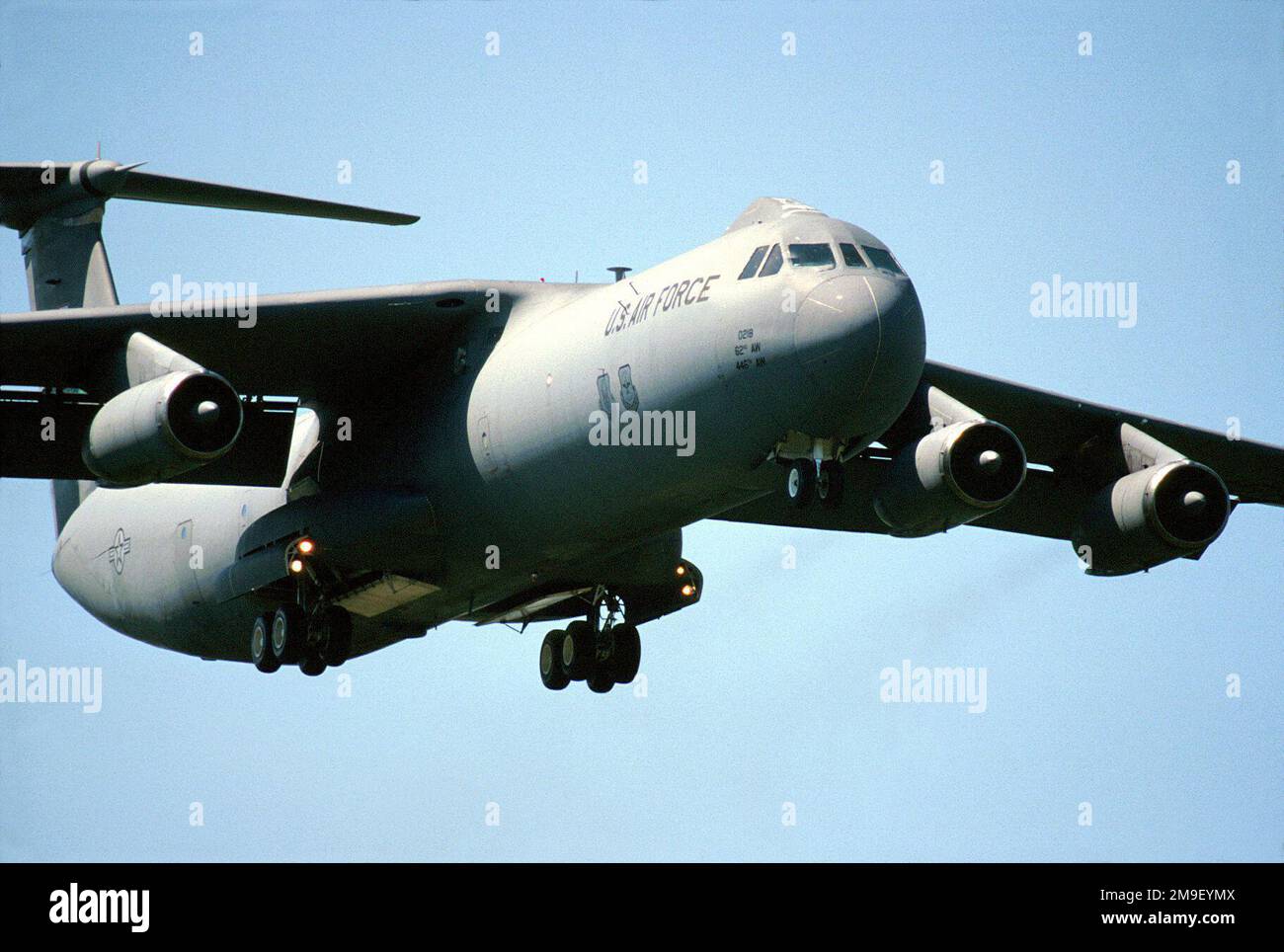 Medium shot, right front view, low angle, a C-141B Starlifter takes off ...
