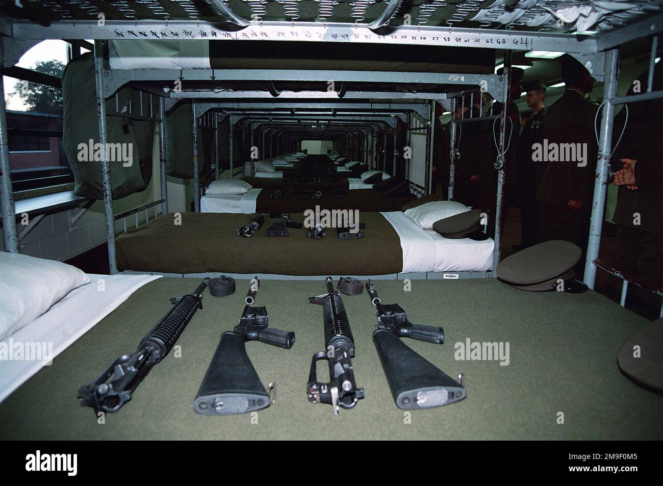 M16 A2 service rifles are laid out on racks for inspection while in the ...