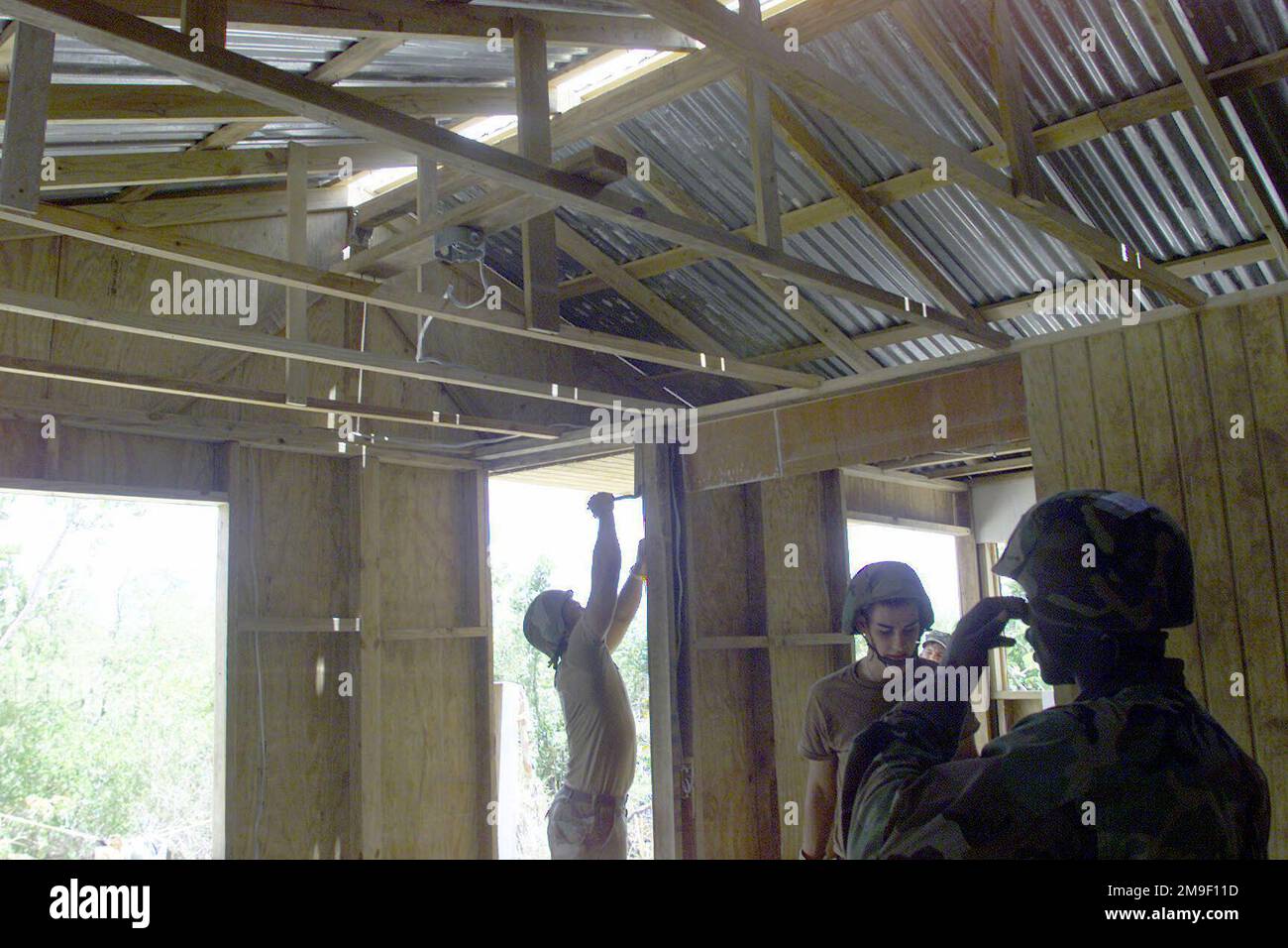 US Navy (USN) Seabees assigned to Naval Mobile Construction Battalion ...