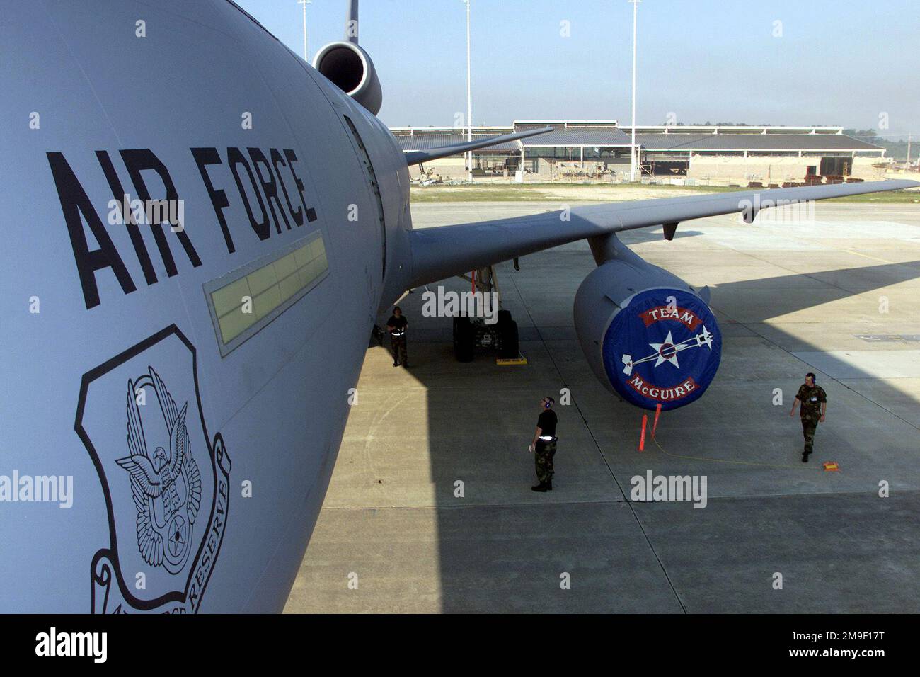 Straight on medium shot down the fuselage on the left side toward the ...