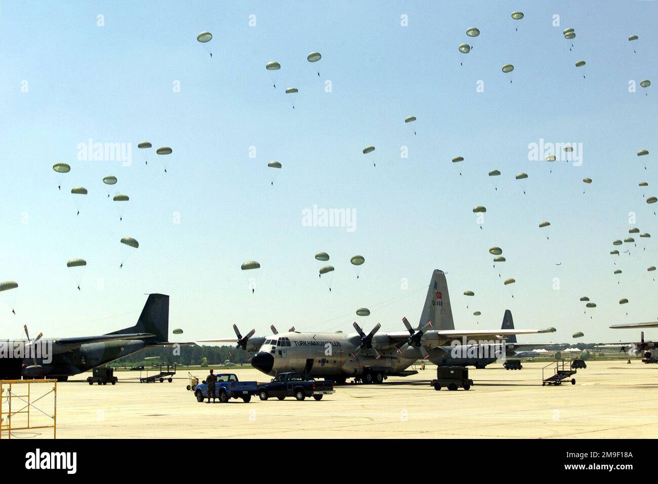 Straight on extreme long shot as US Air Force C-130's from Pope AFB ...