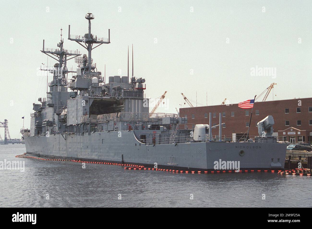 A stern to bow, portside view of the USS NICHOLSON (DD 982), moored at ...