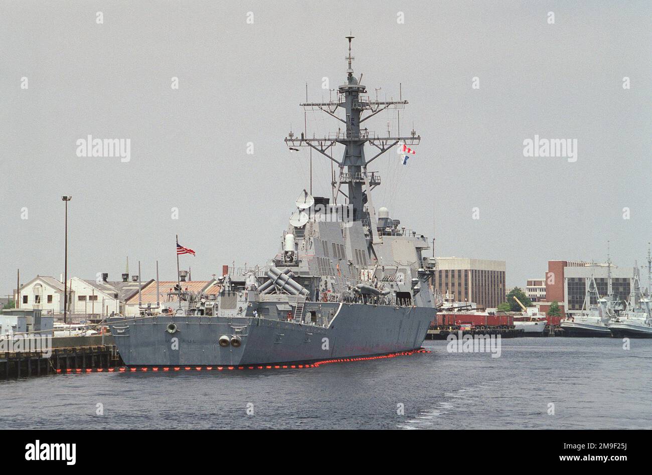 A stern to bow, starboard view of the USS MCFAUL (DDG 74), moored at ...