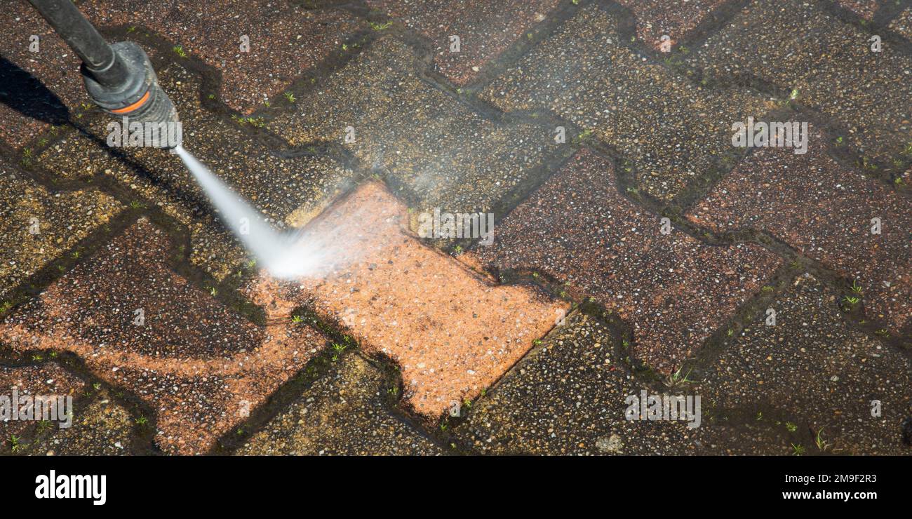 Outdoor floor cleaning with a pressure water jet in banner panorama web ...