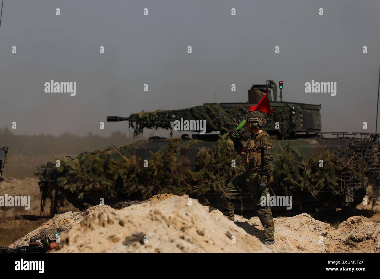 A German army range safety officer assigned to the 212th ...