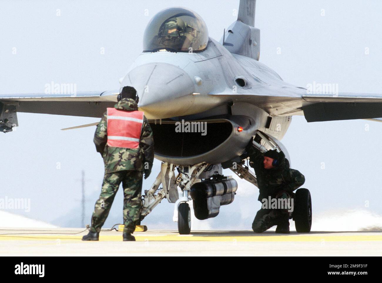 The crew chief of an US Air Force F-16 Fighting Falcon aircraft ...