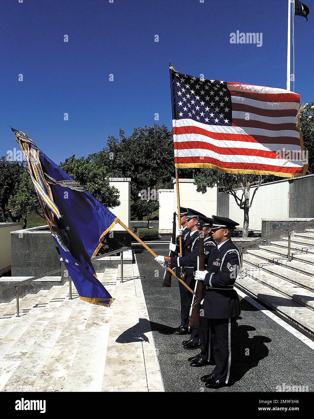 The Hickam Honor Guard displays the colors at the Punchbowl Cemetery ...