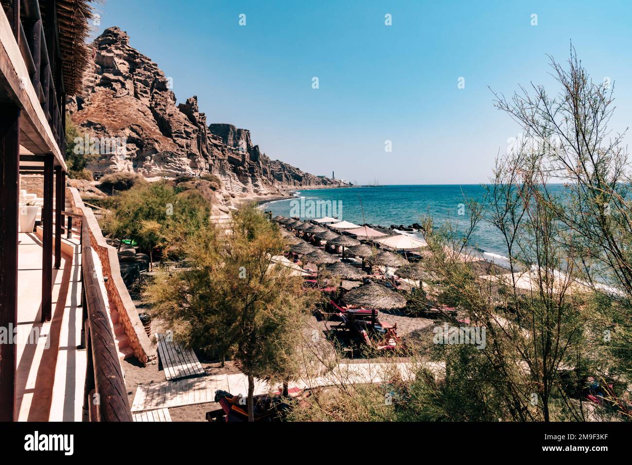 View over the beach area of Theros Wave Bar on Eros beach in Santorini ...