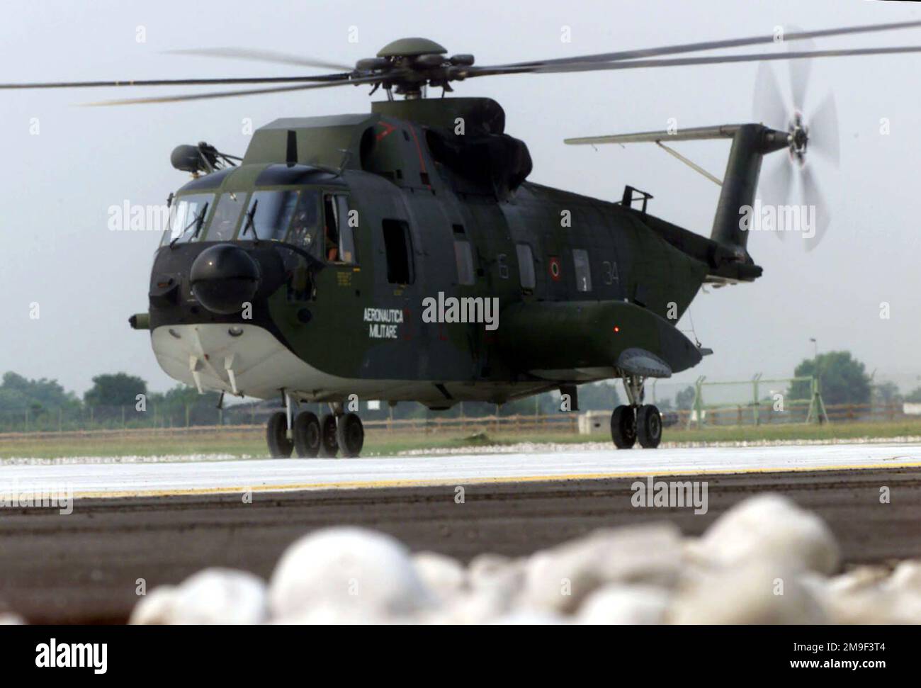 An H-3 (Pelican) helicopter from the Italian Air Force get ready to ...