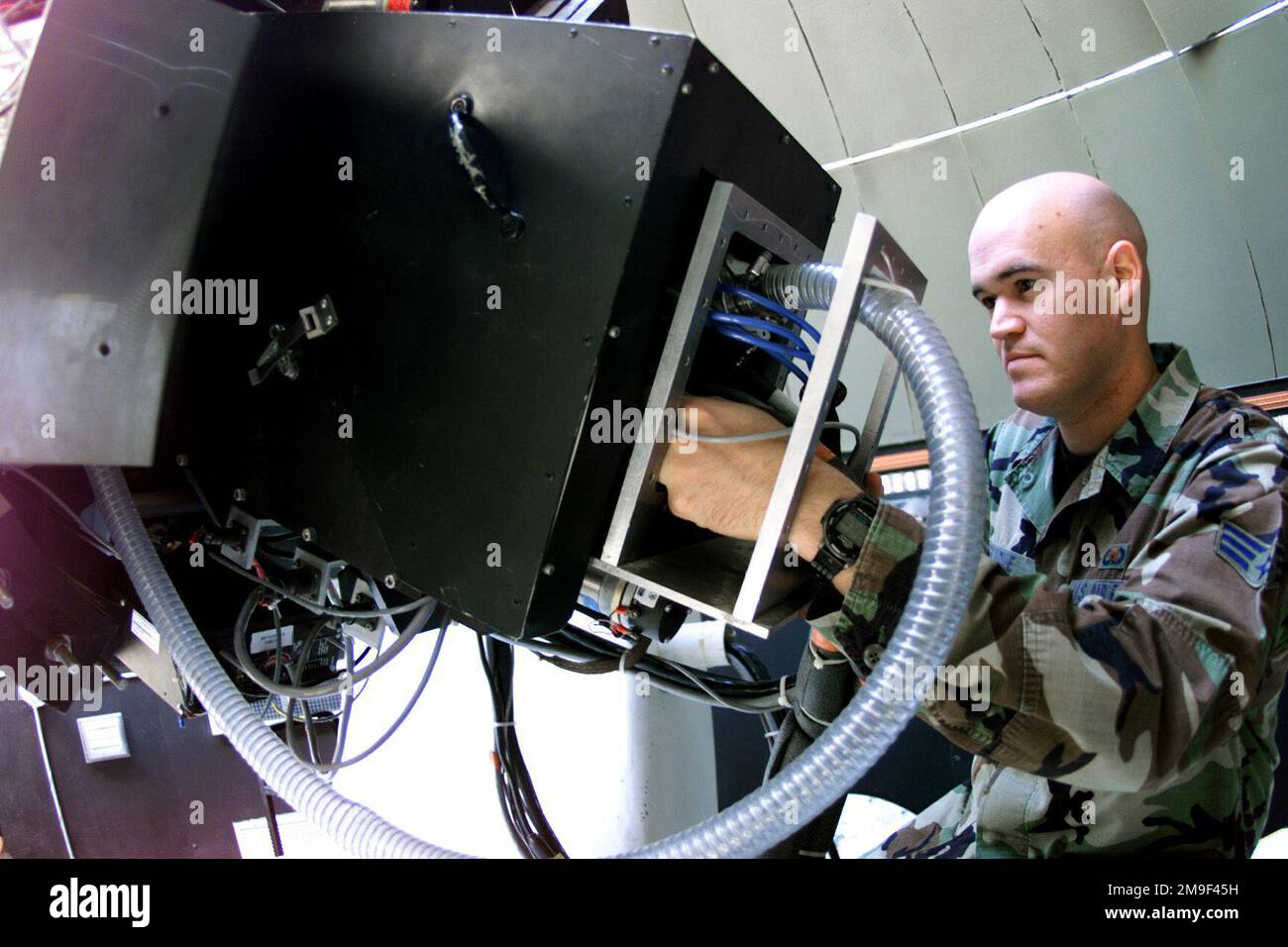 US Air Force SENIOR AIRMAN Matthew Gladue works on the telescope at ...