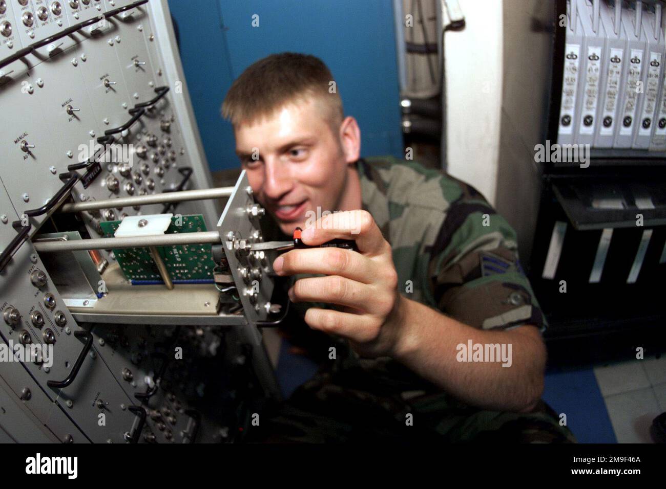 US Air Force SENIOR AIRMAN James Baumgartner checks capacitors on the ...