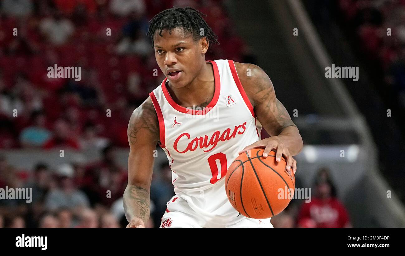 Houston's Marcus Sasser (0) brings the ball up the court against South ...