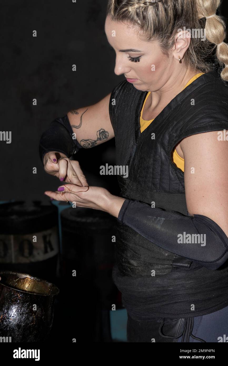preparing to lift stones giving resian in her hands. rural athlete from ...