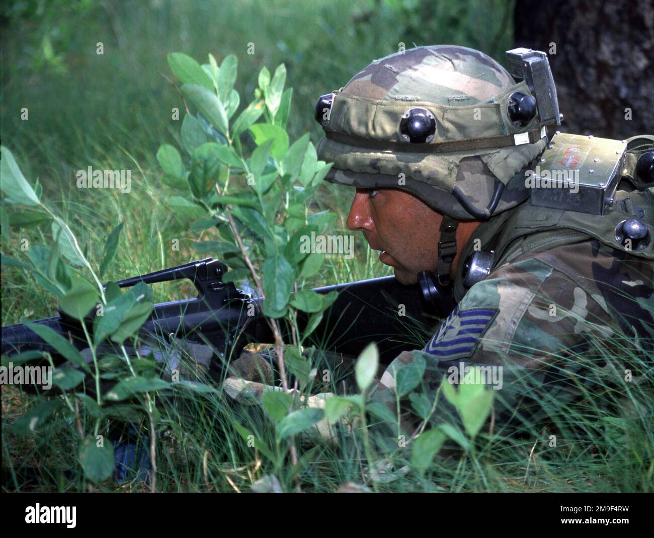 Wearing a Multiple Integrated Laser Engagement System (MILES), a member ...