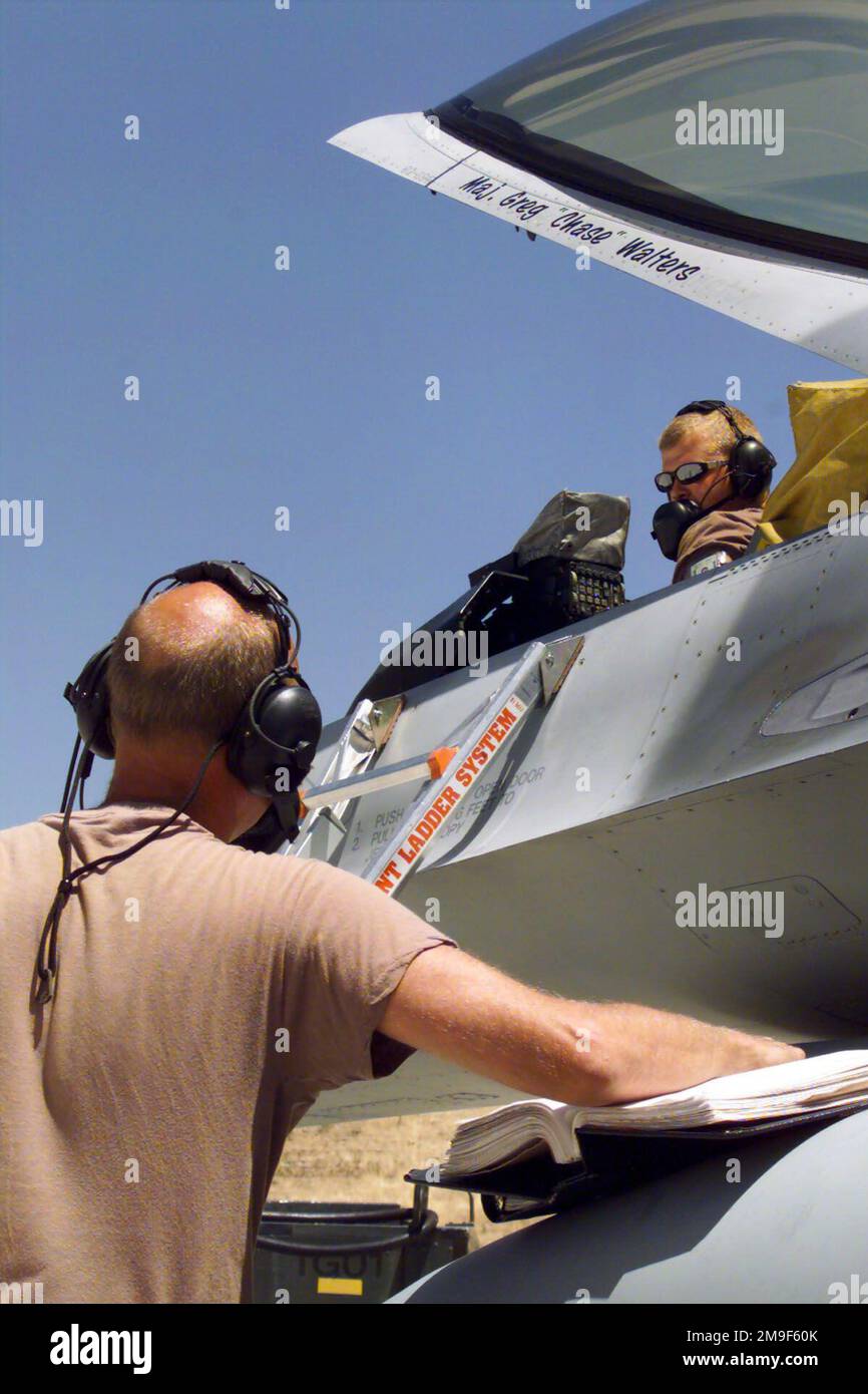 A maintenance crew troubleshoots an air conditioning malfunction on a F ...