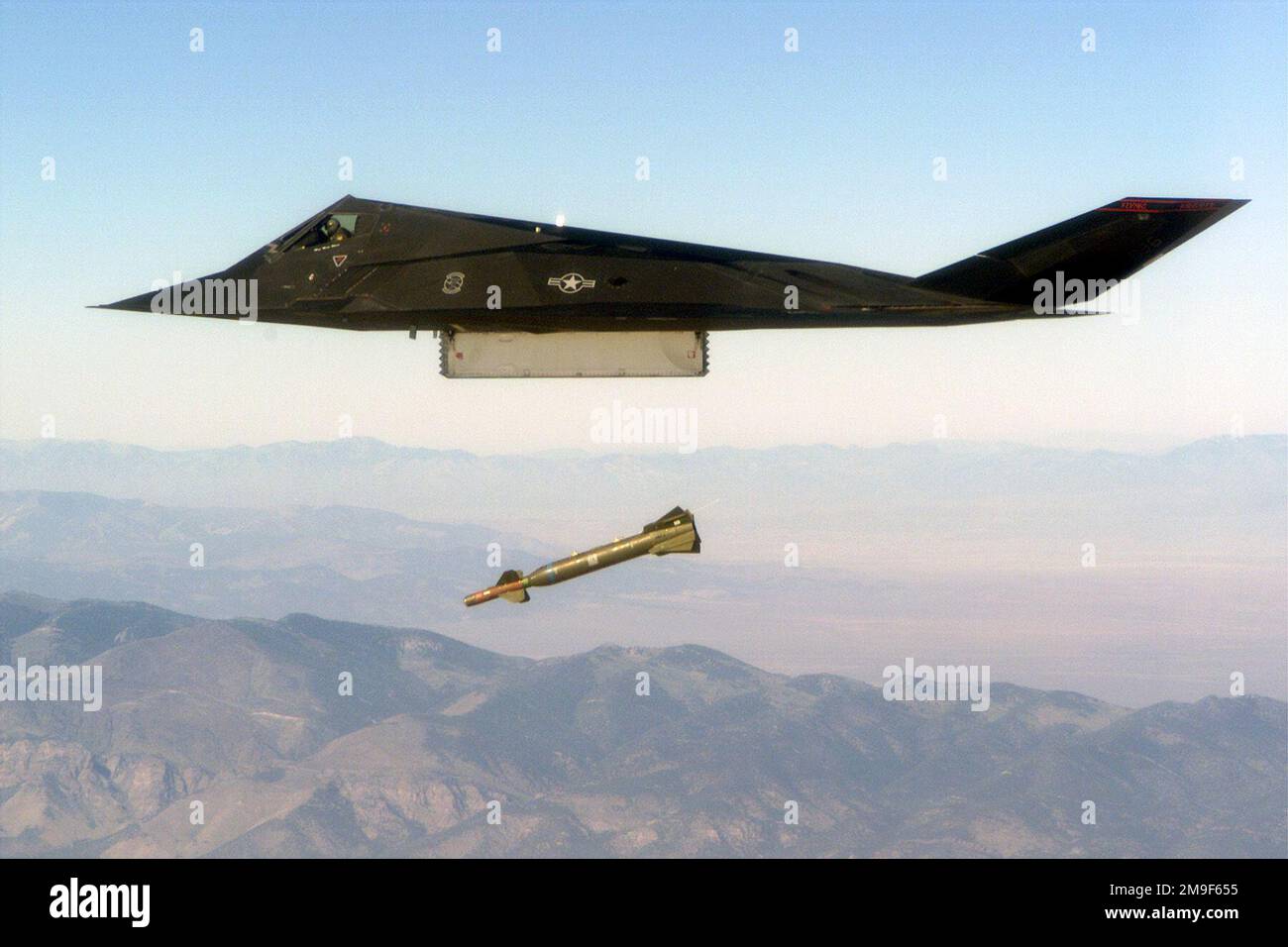 An F-117 Nighthawk engages it's target and drops a GBU-28 guided bomb ...