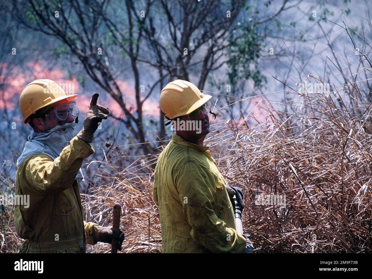 US Air Force STAFF Sergeant Sandy Sanders (right) a strike team leader ...